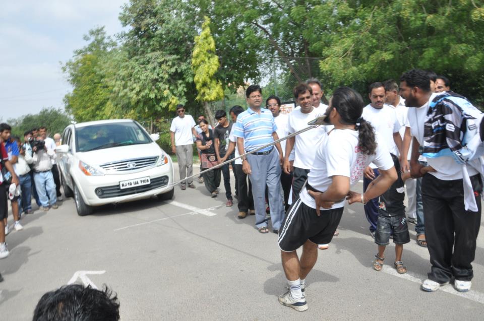 PULLING A CAR WITH BEARD WHILE ON SKATES - India Book of Records